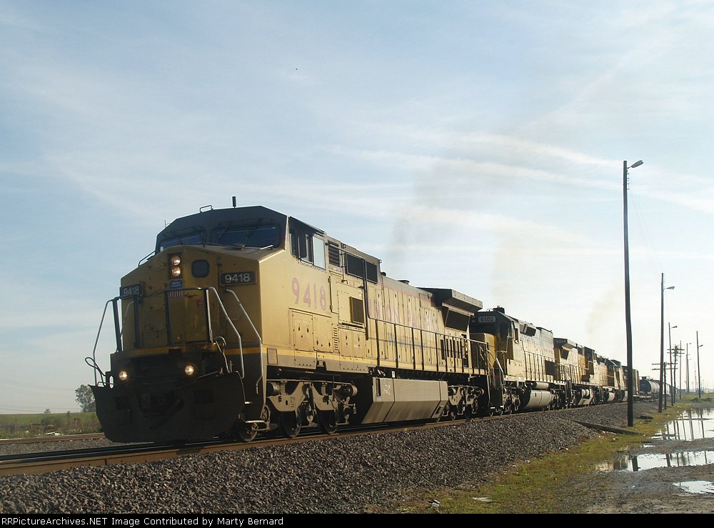 UP 9418 With Train Leaving Avoindale Yard And Heading West